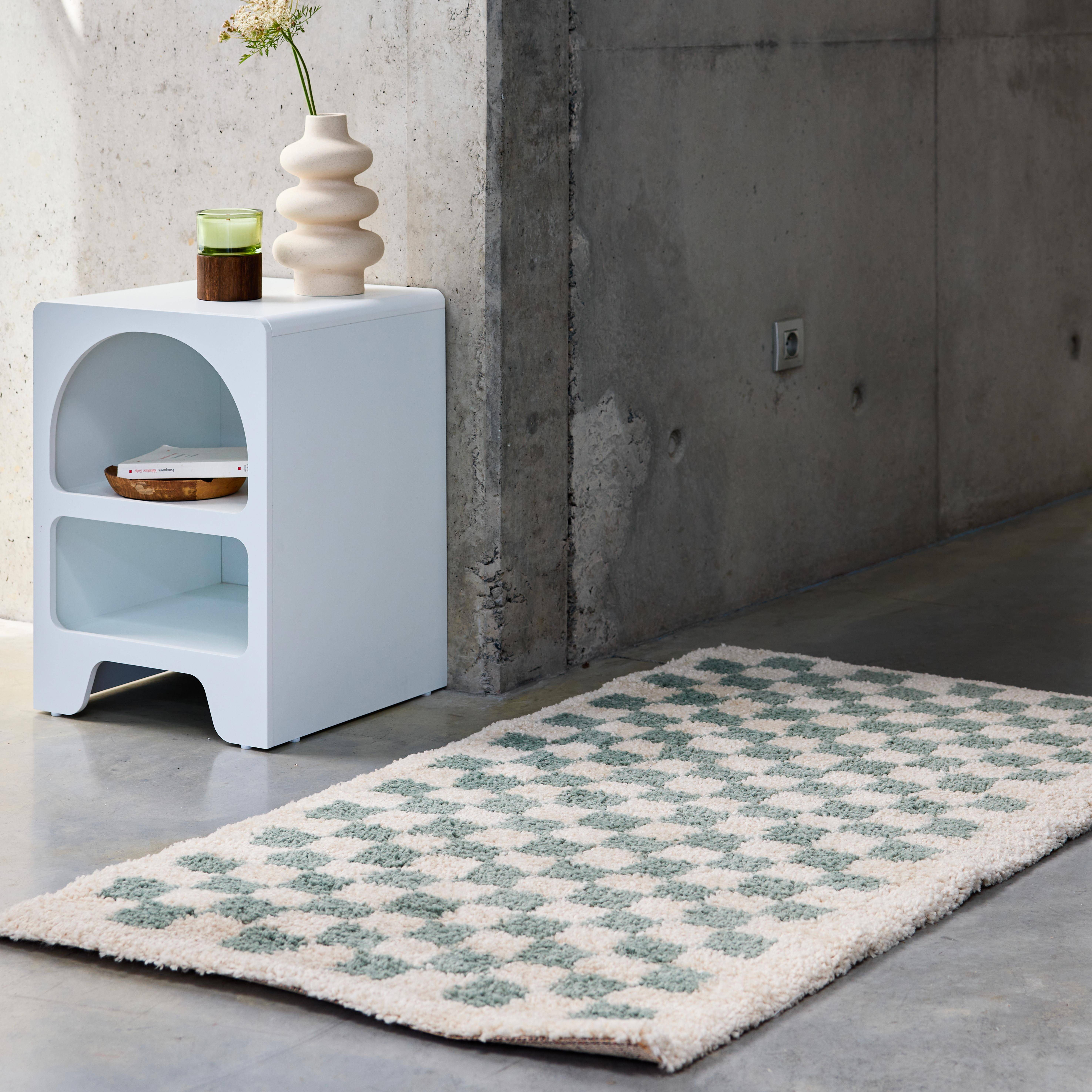 Light blue and cream checkerboard interior rug